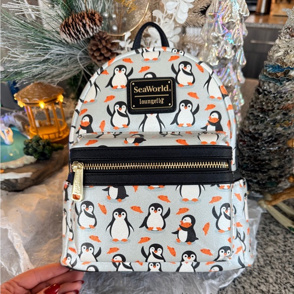 Loungefly | Bags | Loungefly Seaworld Penguin Backpack Black White ...